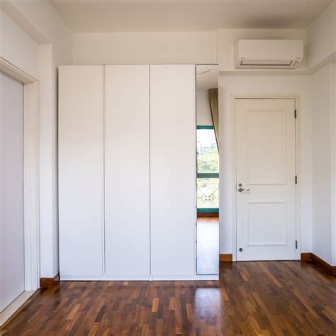 Compact White Swing Wardrobe Design Livspace