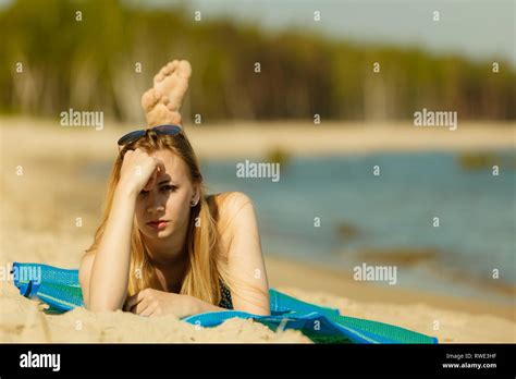 Summertime Pleasures Enjoying Vacation Concept Woman In Bikini Sunbathing And Relaxing On