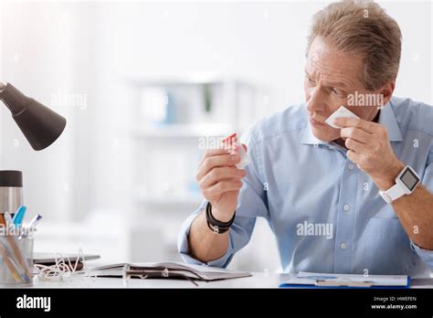 Shocked Male Person Looking On Packing With Pills Stock Photo Alamy