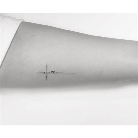 Lettering Cross With The Name Agatha Tattooed On The