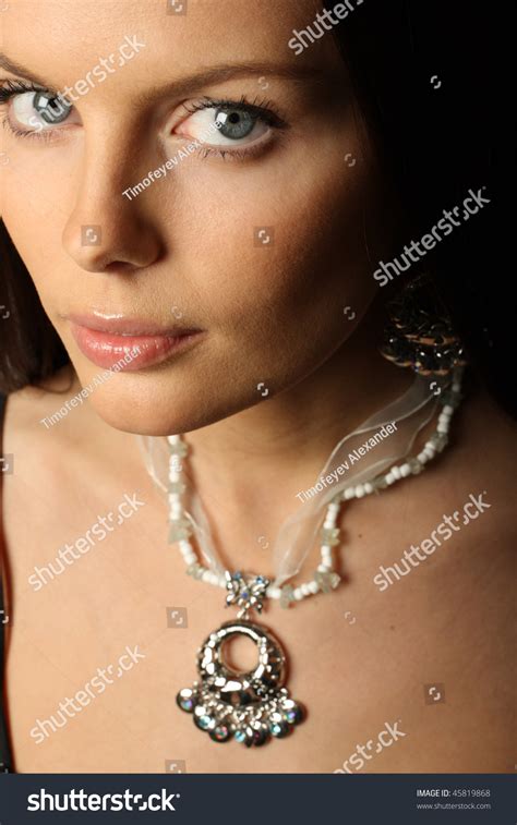 Portrait Of Elegant Beautiful Woman Wearing Jewelry Stock Photo