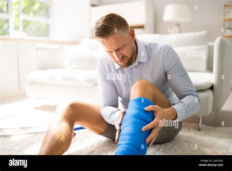 Man With Broken Leg Cast And Crutches Stock Photo Alamy