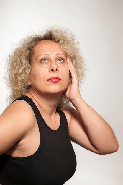 Premium Photo Mid Adult Woman Posing Against White Background
