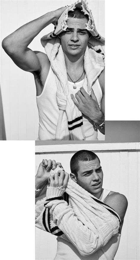 A Man Is Drying His Hair With A Towel