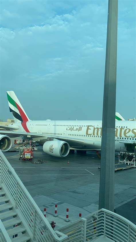 An Airplane Parked On The Tarmac At An Airport