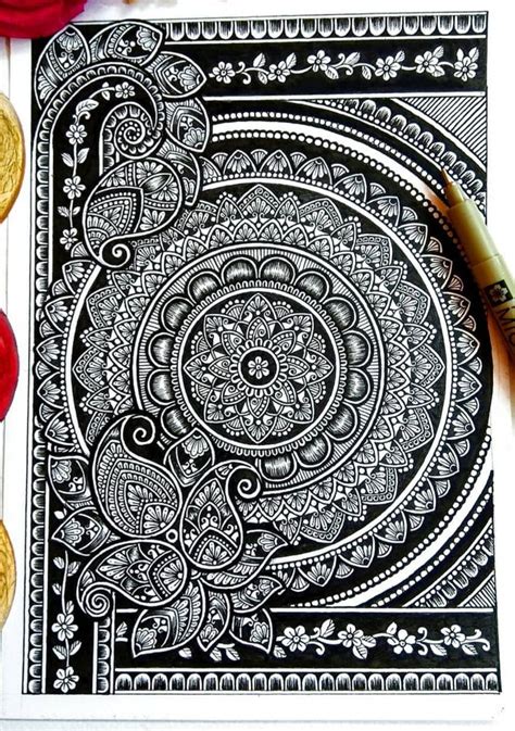 A Black And White Drawing With Some Gold Coins Next To It On Top Of A Table