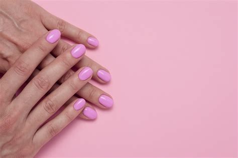 Premium Photo Female Hands With Pink Nail Polish Glamorous Manicure