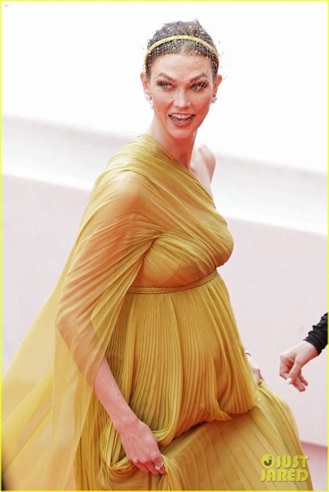 Karlie Kloss Cradles Her Growing Baby Bump While Attending Indiana