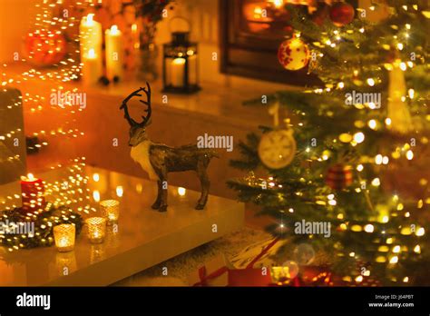 Reindeer Decoration In Ambient Living Room With Candles And Christmas