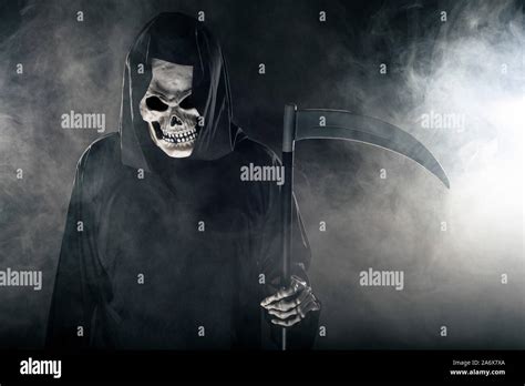 Scary Looking Grim Reaper Ghost Wielding A Scythe Or Sickle Coming Out