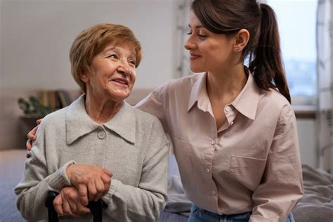 Free Photo Female Nurse Taking Care Of Elderly Person