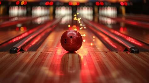 Premium Photo Bowling Strike Bowling Ball Crashing Into The Pins