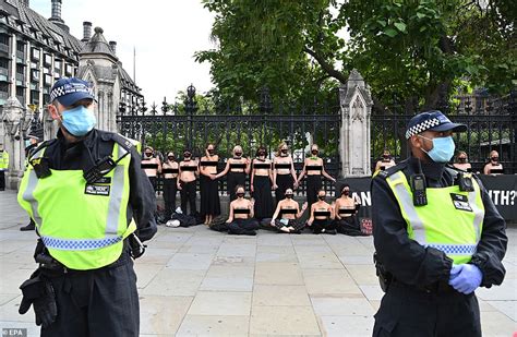 Topless Extinction Rebellion Activists Padlock Themselves To The Gates