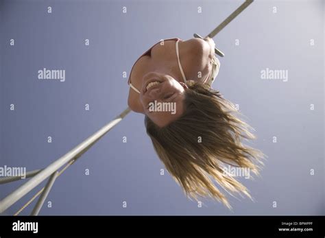 Low Angle View Of A Woman Hanging Upside Down Venice Beach California