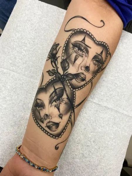 A Woman S Arm With Two Faces And An Arrow On The Other Side Of It