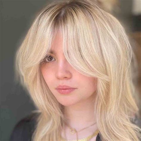 15 Best Blonde Wolf Cut With Bangs HairAide