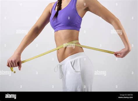 Beautiful Woman Measuring Her Waist Stock Photo Alamy