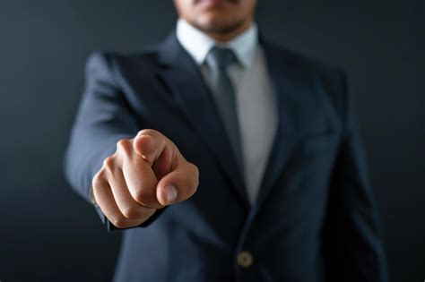 Close Up Professional Businessman In Suit Pointing Forward Leadership