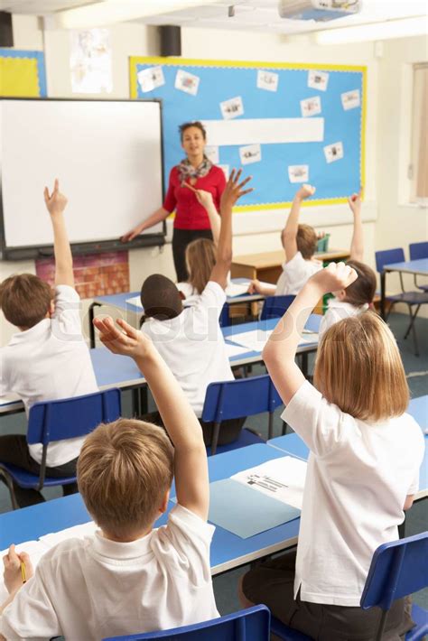 Schüler im Klassenzimmer mit Lehrer Stock Bild Colourbox