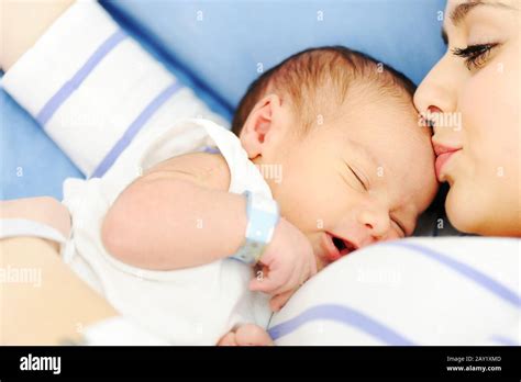 Woman Holding Her Newborn Baby At Hospital Stock Photo Alamy