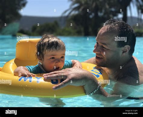 Father And Baby Son In Swimming Pool Stock Photo Alamy