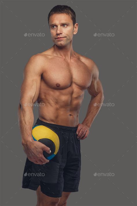 Shirtless Middle Age Man Holding Colorfull Ball Stock Photo By Fxquadro