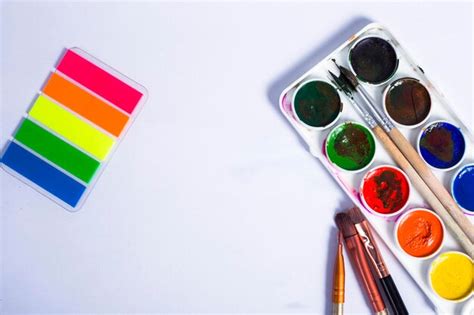 Premium Photo Set Of Watercolor Paints And Brushes For Painting