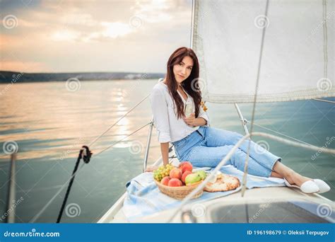 Woman With Glass Of Champagne Resting On Yacht Stock Image Image Of