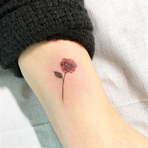Red Rose Tattoo On The Left Inner Arm