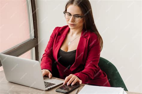 Premium Photo Female Office Worker Or Secretary Is Working With A Laptop On The Office Desk