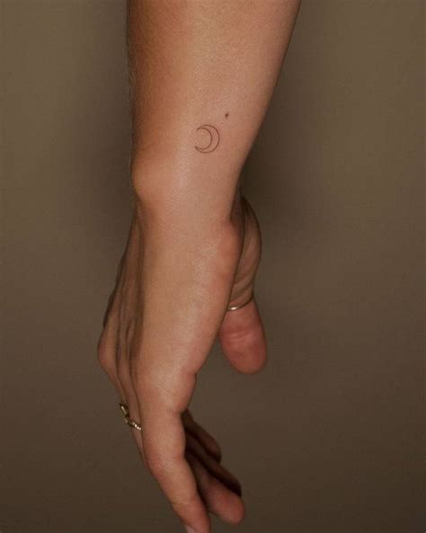 Minimalistic Style Crescent Moon Tattoo Placed On The
