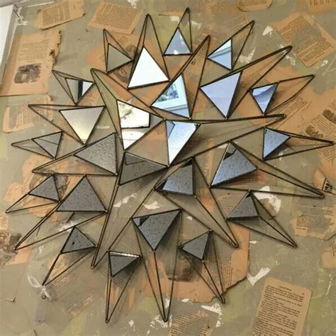A Group Of Mirrors Sitting On Top Of A Table