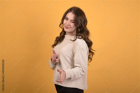 Hey You Bang Charismatic Caucasian Brunette Girl With Wavy Hair In A Casual Jumper Winking And