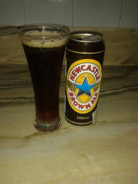 A Beer Is Next To A Glass On The Counter