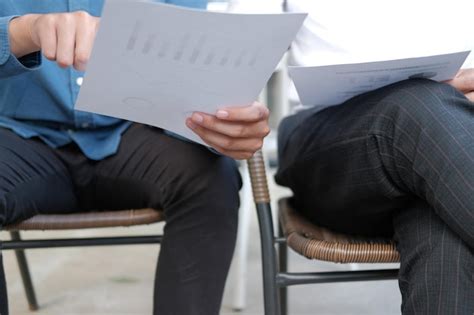 Premium Photo Midsection Of Man Reading Book While Sitting On Seat