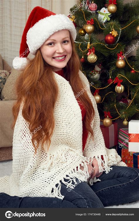Happy Redhead Girl Portrait In Christmas Decoration Home Interior With Fir Tree And Ts New
