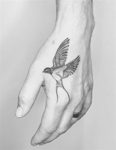 Swallow On The Hand Tattoo Hand Tattoos Hand Tattoos For Guys