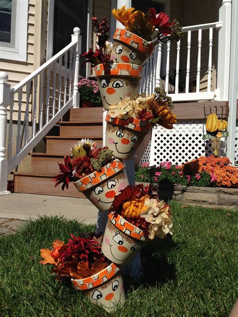 Terra Cotta Pots Painted And Then Dropped Down A Dowel Rod Stuff With