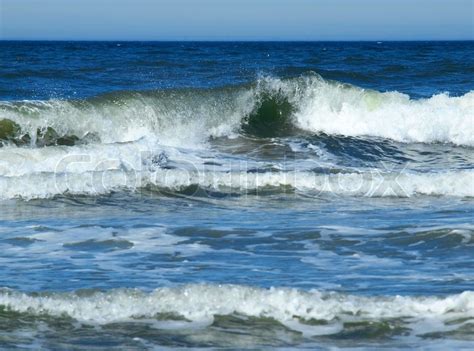 An Ocean Wave Breaking On Shore On A Stock Image Colourbox