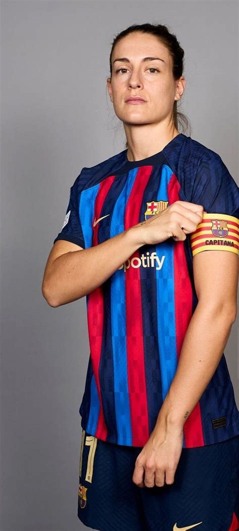 A Female Soccer Player Is Posing For A Photo With Her Arm Wrapped