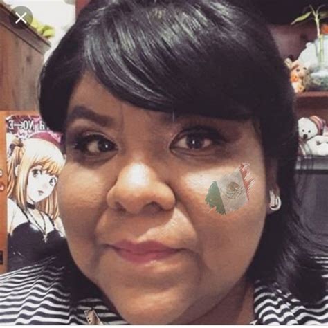 A Close Up Of A Person With Tattoos On Their Face