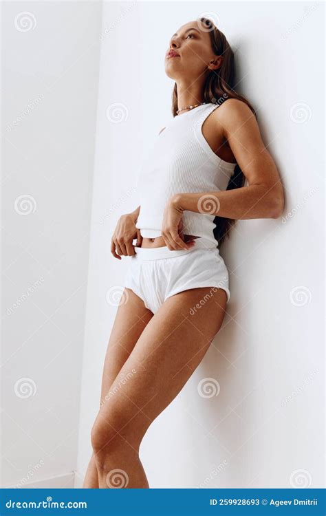 A Beautiful Woman Model With Tanned Skin And A Beautiful Slender Body