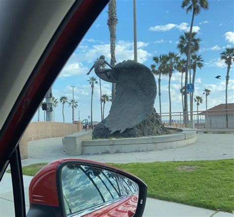 Naked Surfer Statue In Huntington Beach Ca Photos