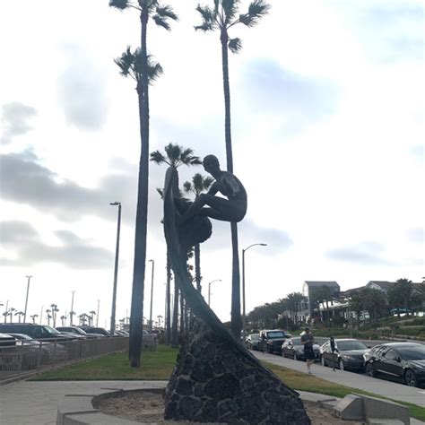 Naked Surfer Statue In Huntington Beach Ca Photos