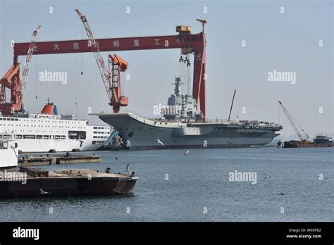 Chinese Workers Labor On The Deck Of China S First Domestically Built