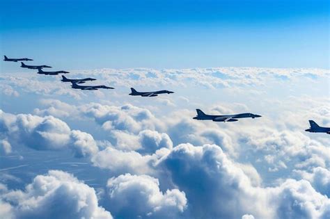 Premium Photo A Group Of Fighter Jets Flying Through The Sky