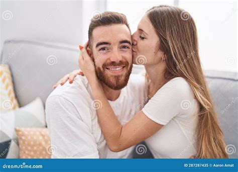 Man And Woman Couple Sitting On Sofa Kissing At Home Stock Image Image Of Male Rest 287287435
