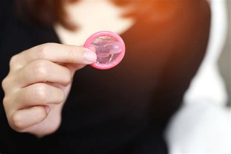 Premium Photo Condom Ready To Use In Female Hand Give Condom Safe Sex