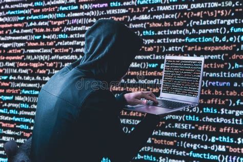 anonymous hacker with laptop in front of binary code cyber security stock image image of