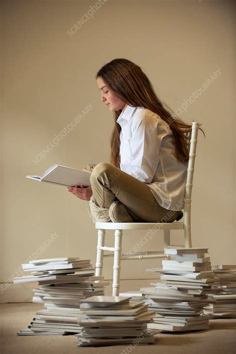 Girl Sitting On Chair Reading Book Stock Image F007 9332 Science